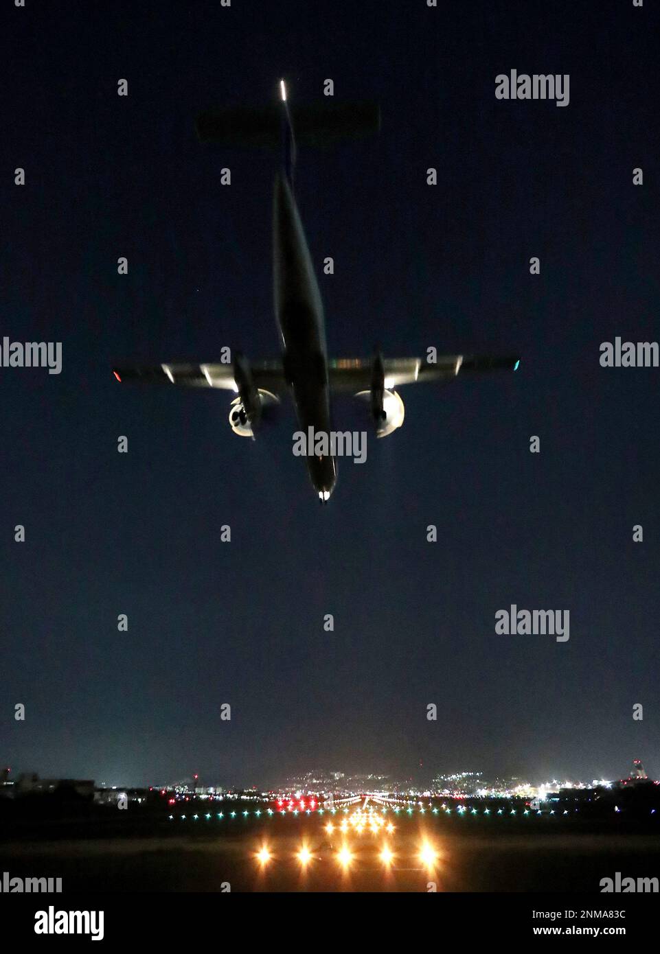 A photo shows a airplane taking off from Itami Airport at Itami Sky ...