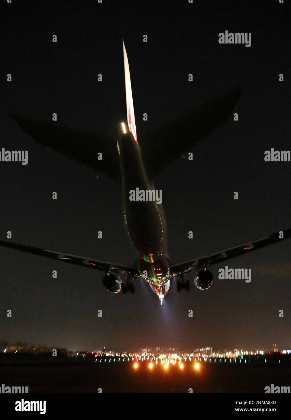 A photo shows a airplane taking off from Itami Airport at Itami Sky ...