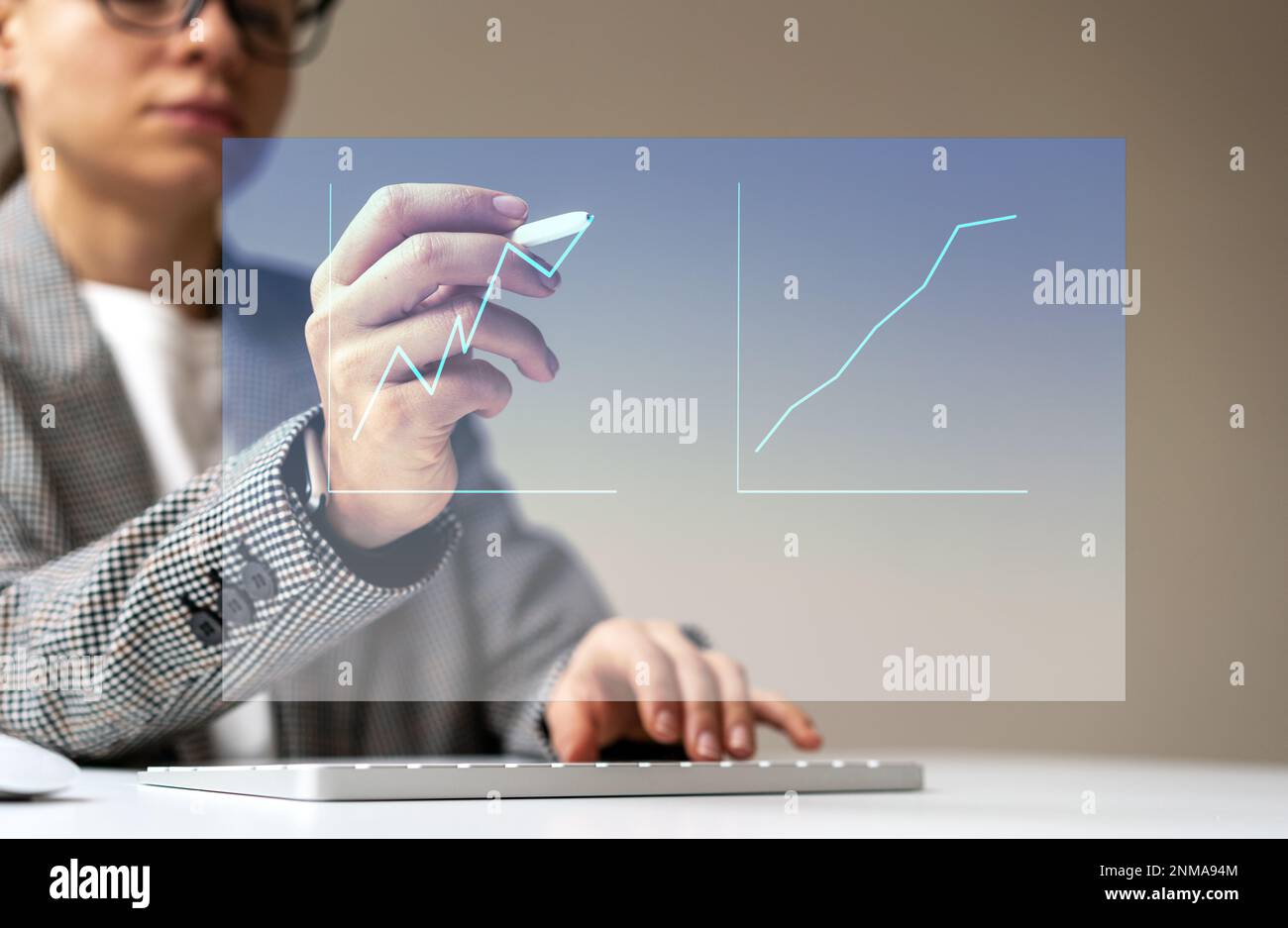 Female business person working with financial graphs using stylus ...