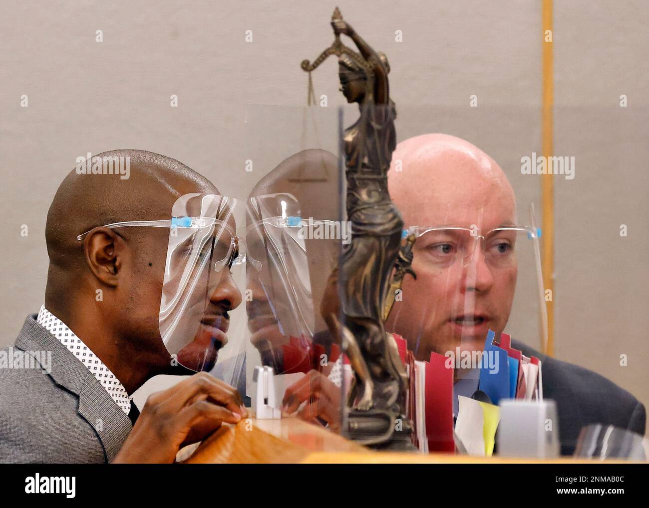 Prosecutor Glen Fitzmartin, right, and defense attorney Kobby Warren ...