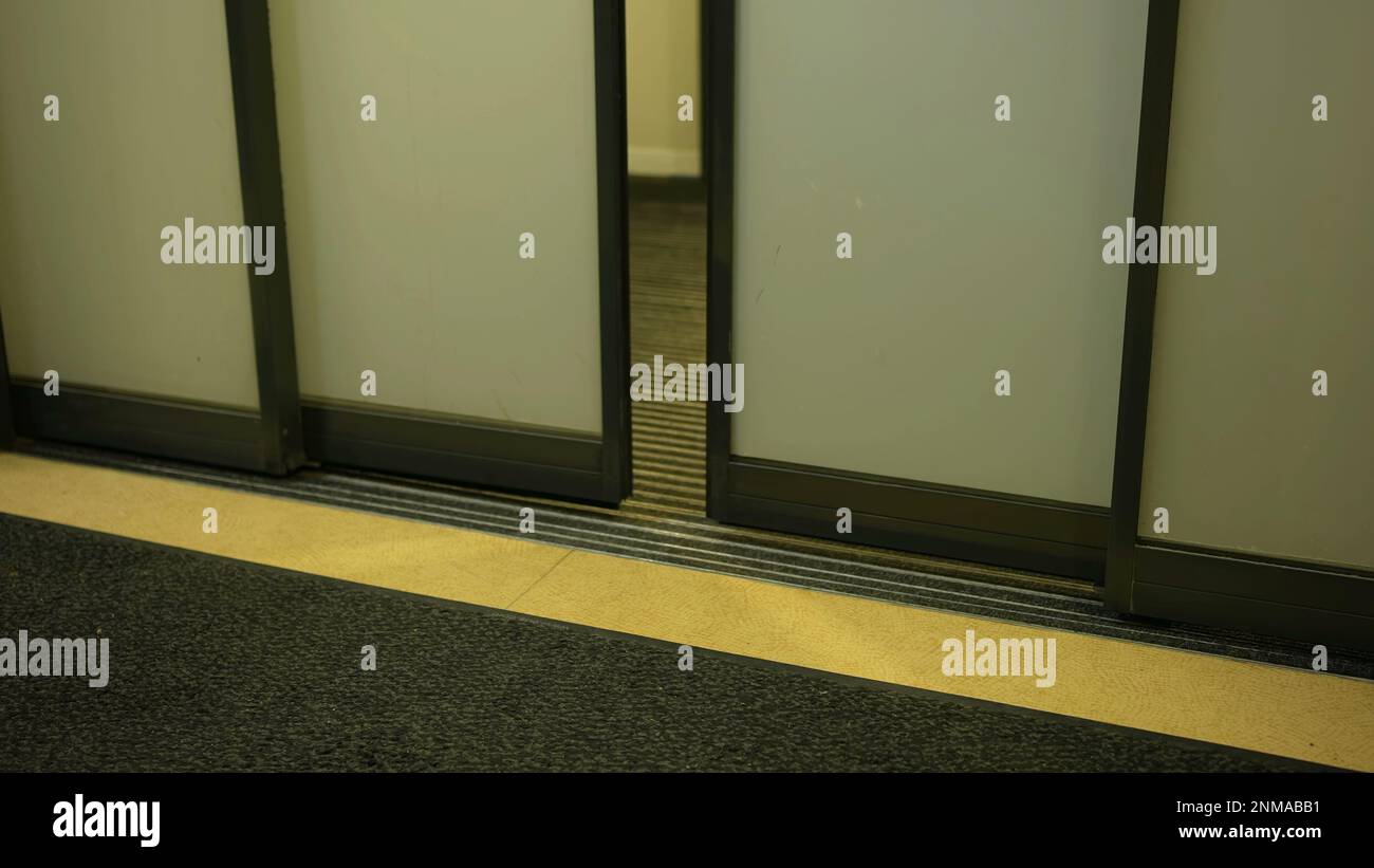 Contactless Automatic Doors Close. Frosted glass door shutting. Closeup ...