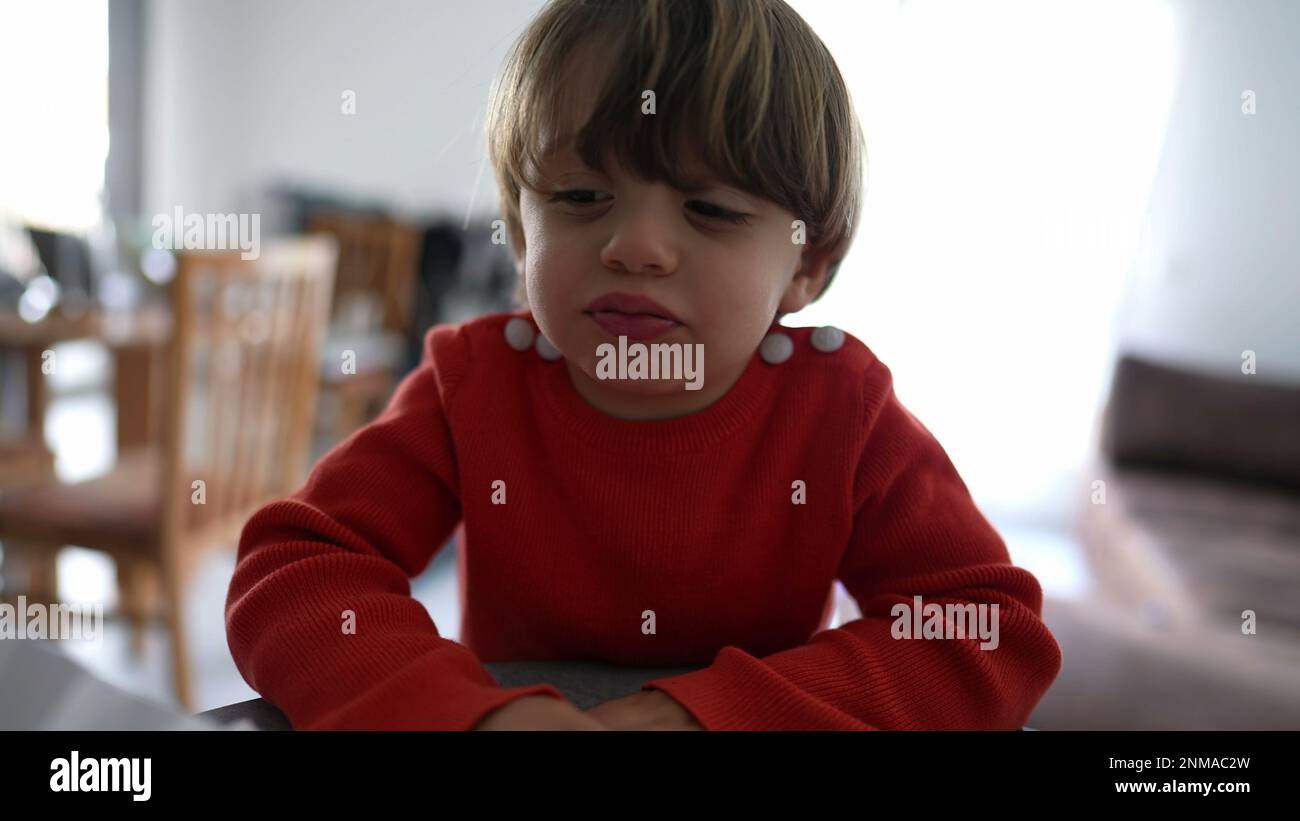 Mischievous little boy spitting to camera. Naughty child not behaving ...