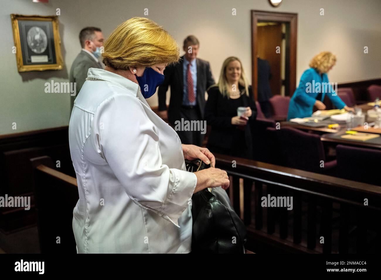 Greg McMichael's wife, Leigh McMichael stands in the courtroom during ...
