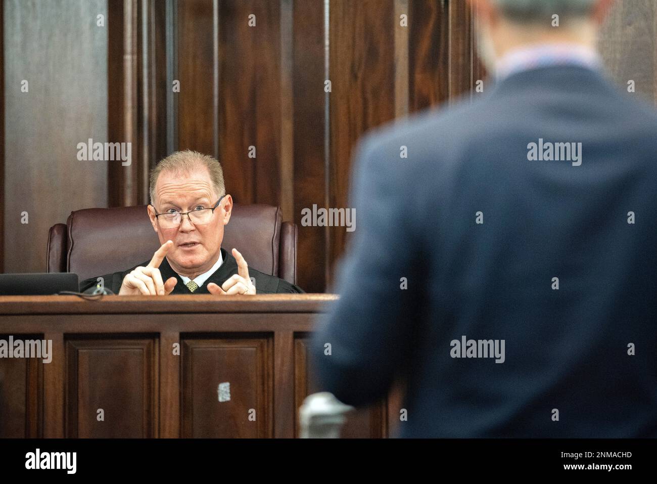 Superior Court Judge Timothy Walmsley speaks with attorney Jason B ...
