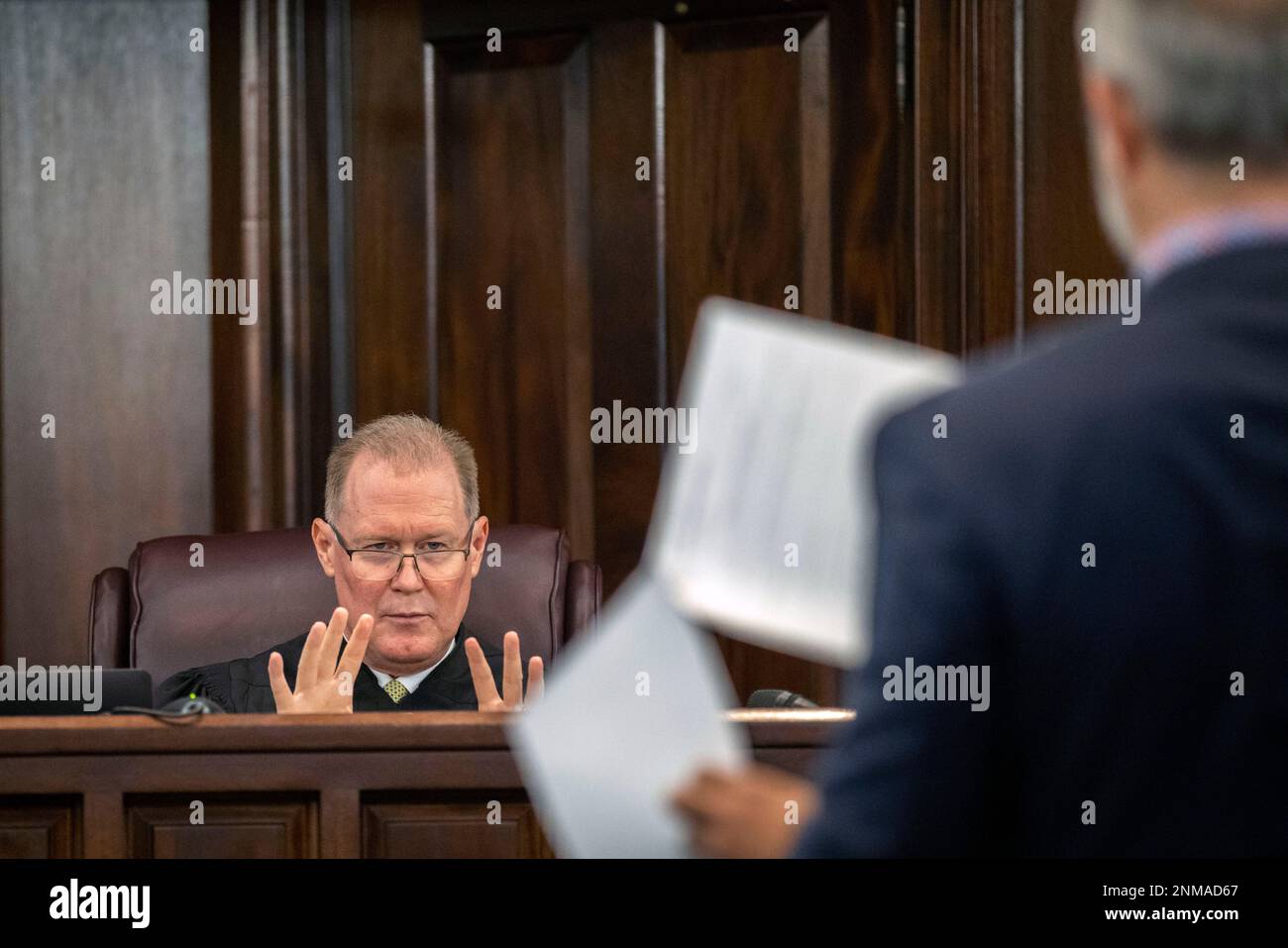 Superior Court Judge Timothy Walmsley speaks with attorney Jason B ...