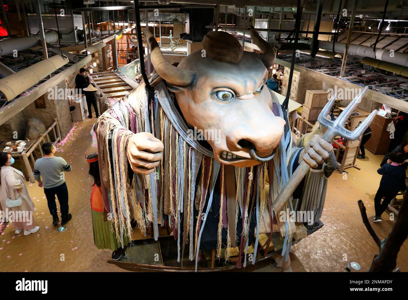 A view of bull-head monster in a foodcourt featuring characters from ...