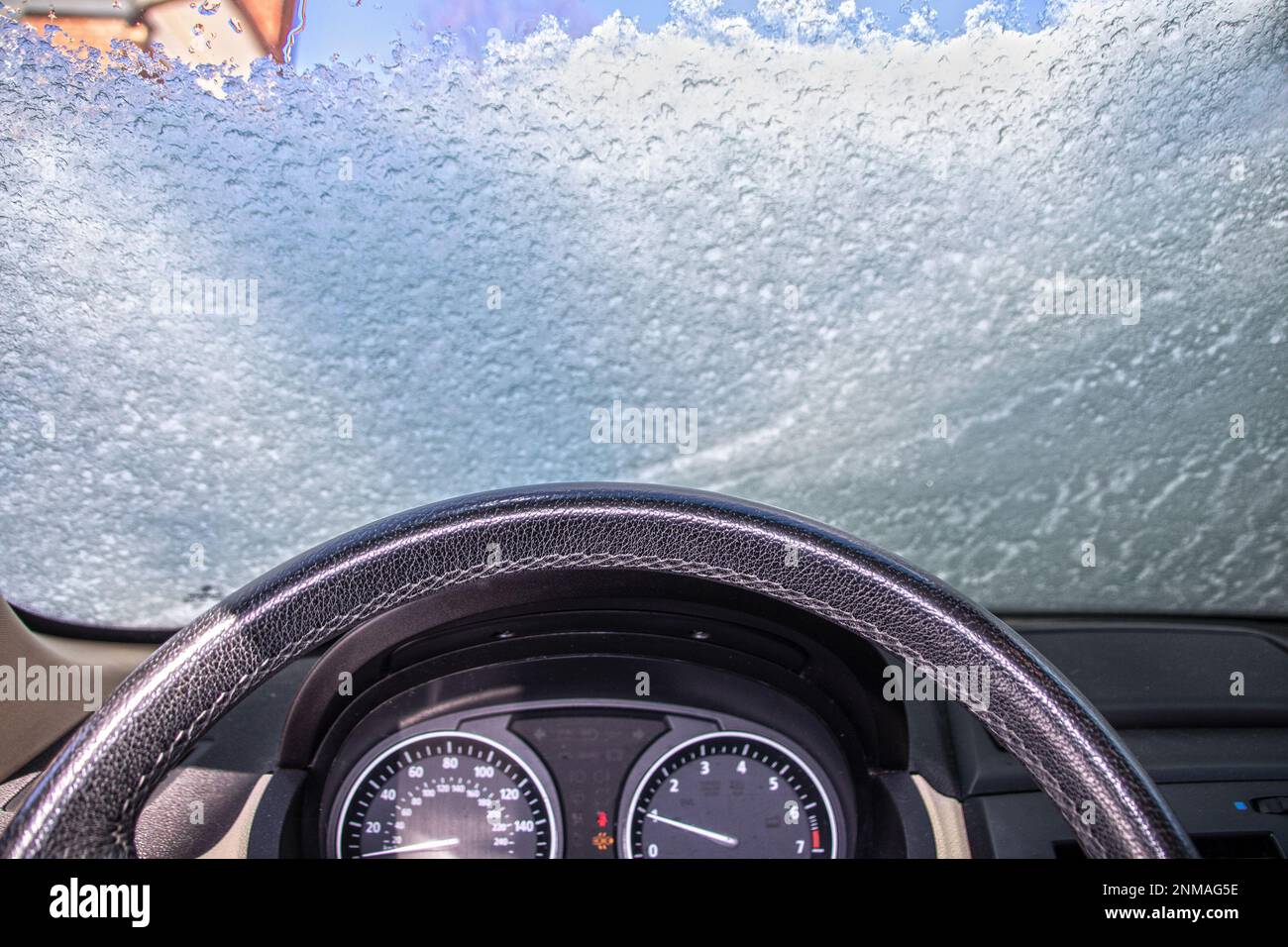 Driving on a snowy day- view from drivers seat with snow covering ...
