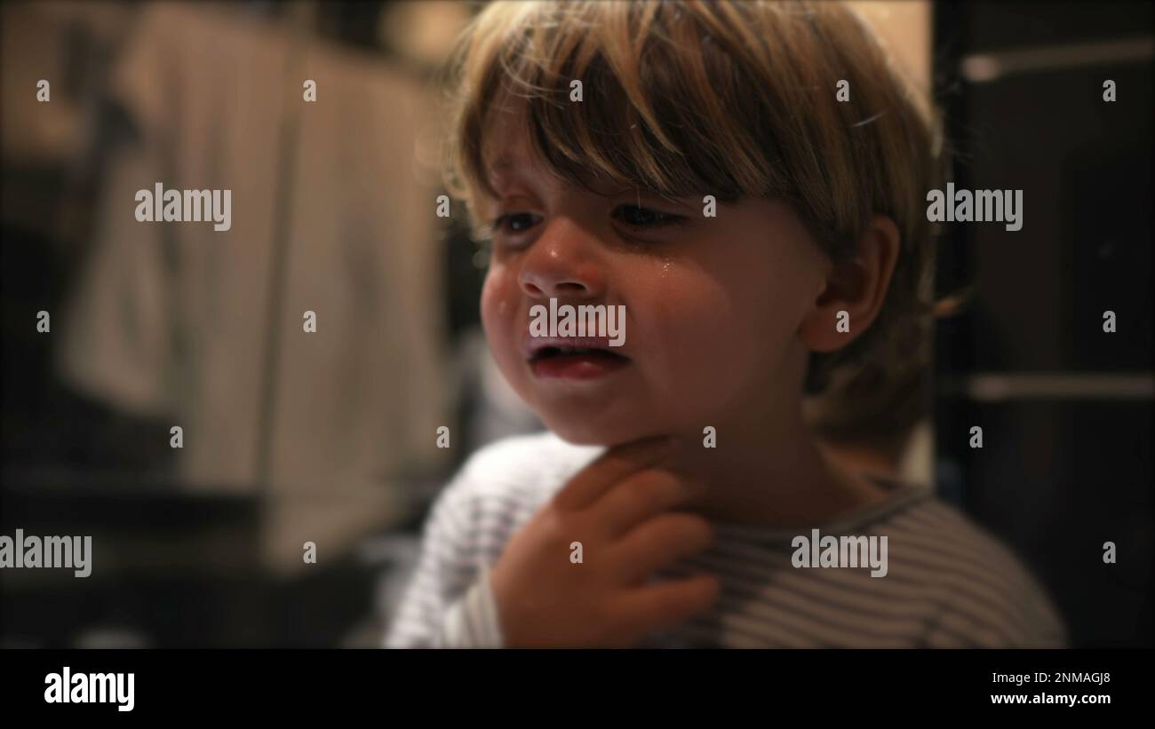 Tearful child crying after getting hurt. One little boy cries. Upset ...