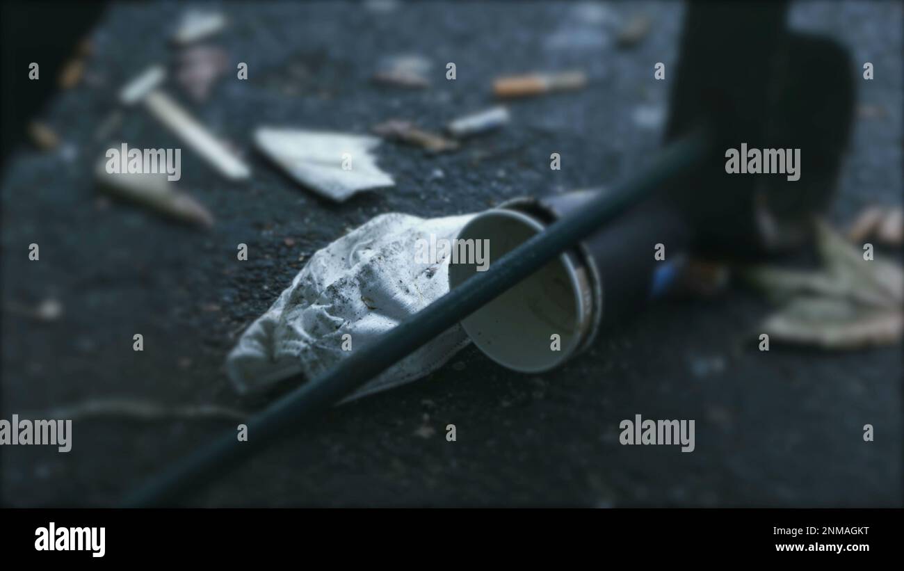 Trash on ground. Empty cup and surgical face mask on asphalt. dirty ...