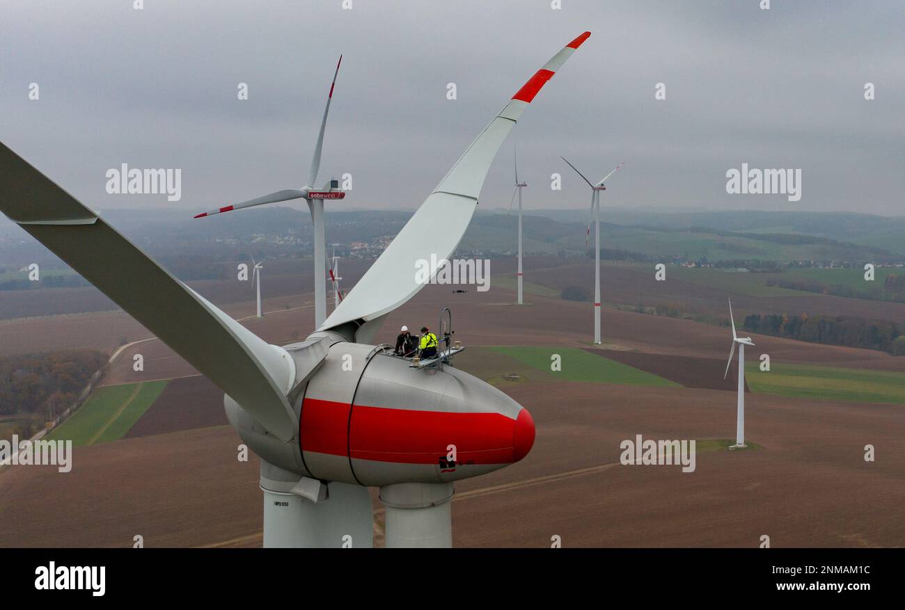 Two technicians from Sabowind GmbH maintain an Enercon E92 wind turbine ...