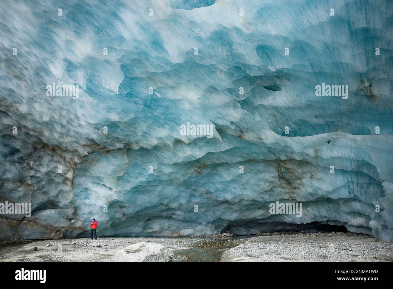 Mountain guide Daniel Ruppen visits an ice cave formed at the end ...