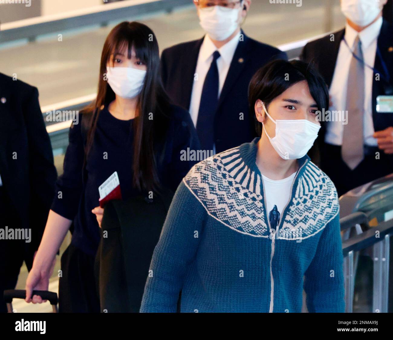 Kei Komuro (R) and Mako, Japanese former Princess, head for an airplane ...