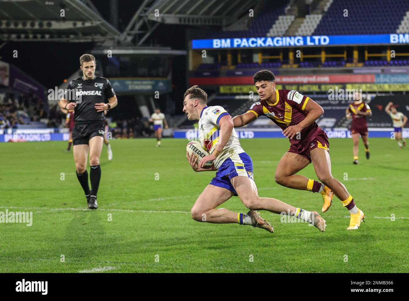 Matty Ashton #5 of Warrington Wolves runs in a 50 yard solo try during ...
