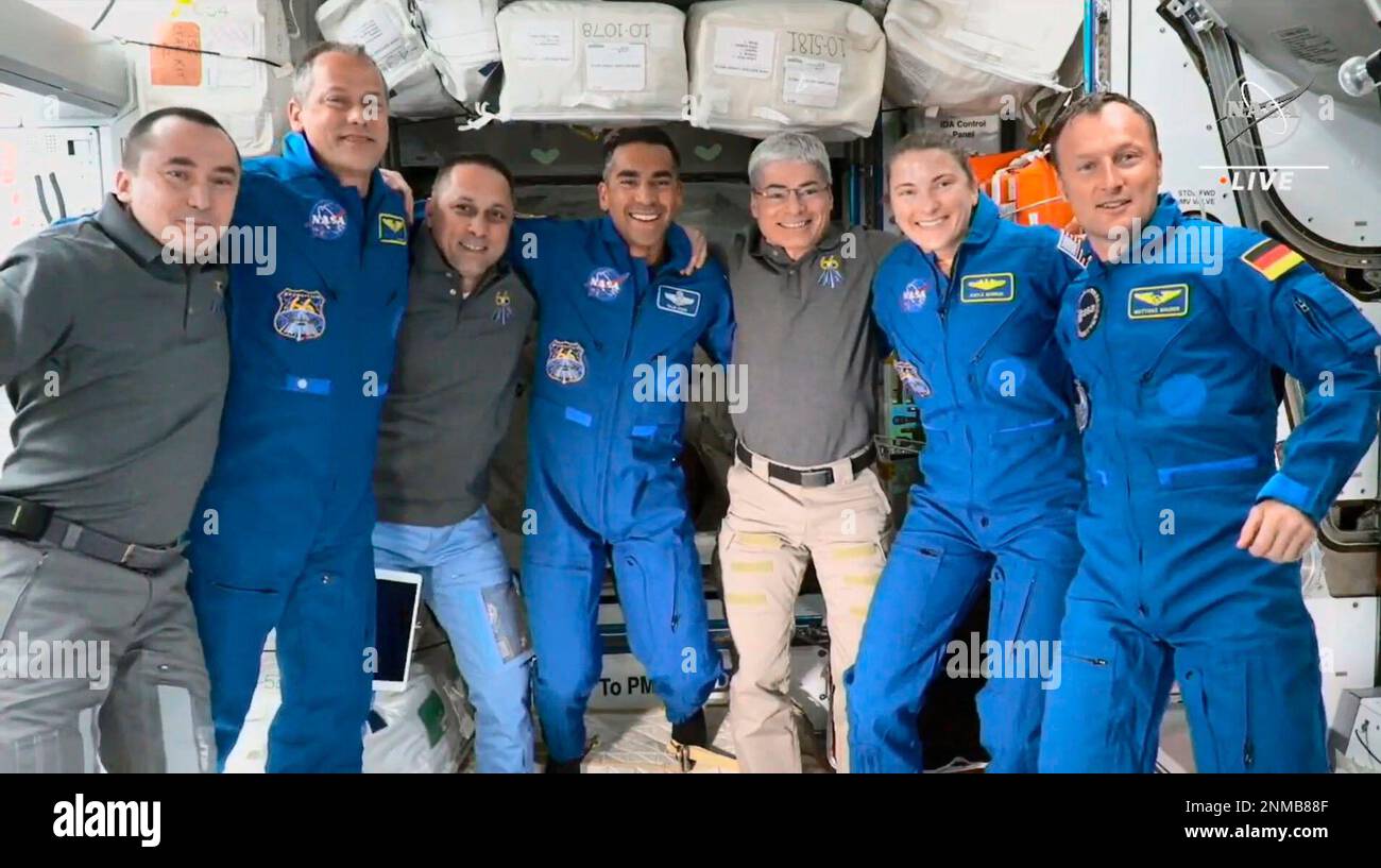 In this image from video provided by NASA, the Expedition 66 crew poses ...