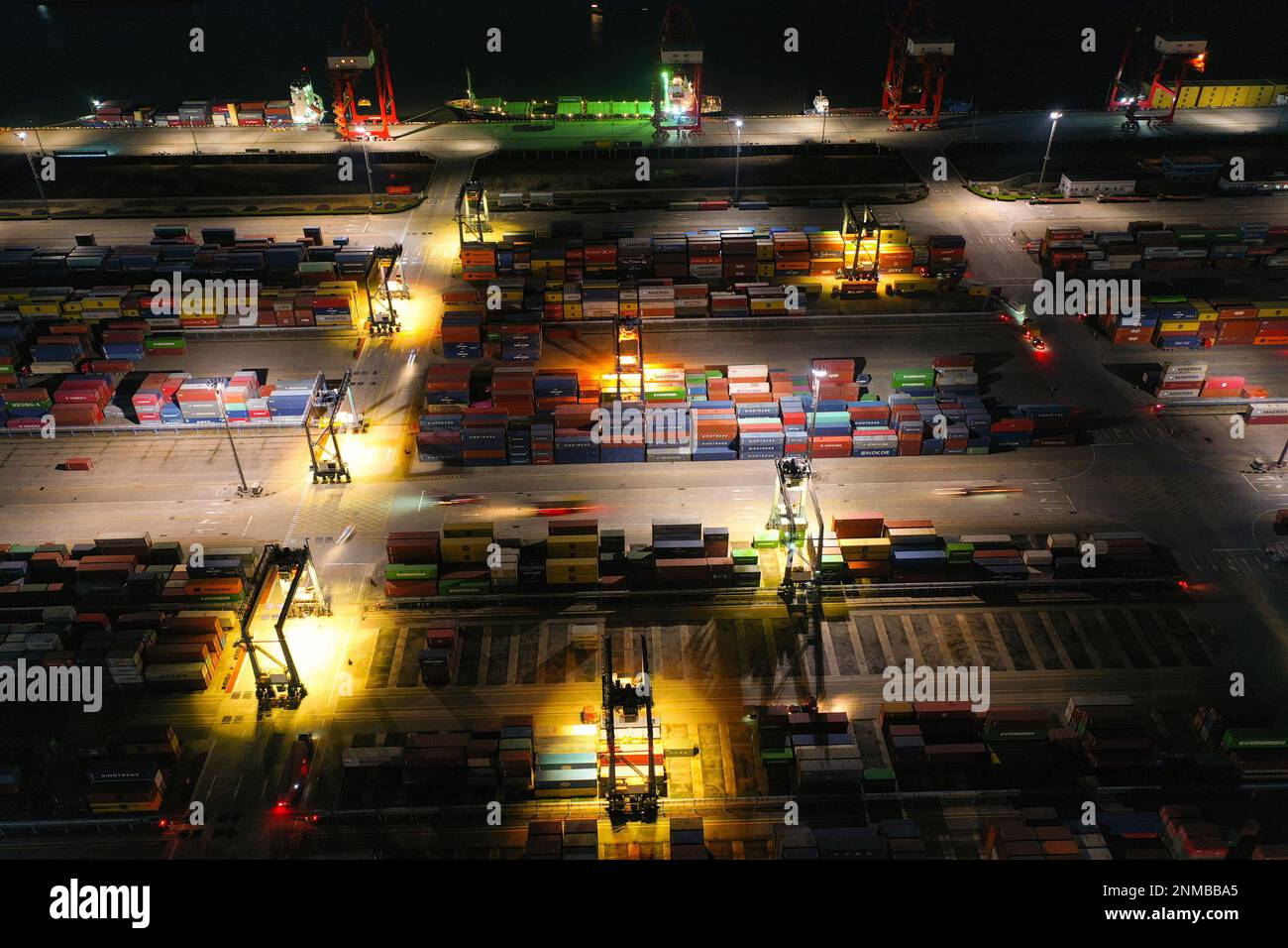 An aerial view of a container dockyard in the night on the Yangtze ...