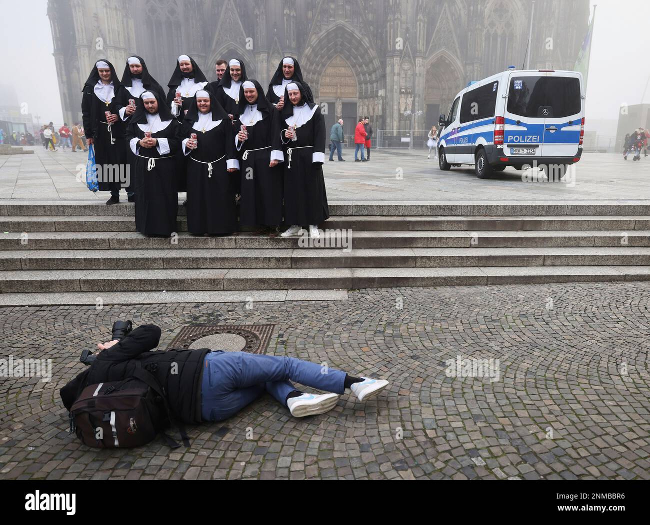 Carnival revelers dressed as nuns pose for a photo at the launch of the ...