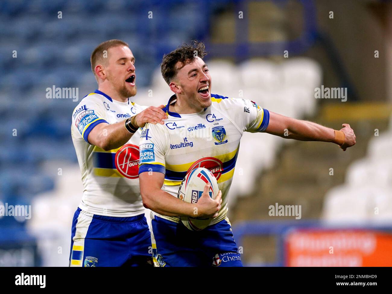Warrington Wolves' Matty Ashton (right) celebrates after scoring his ...