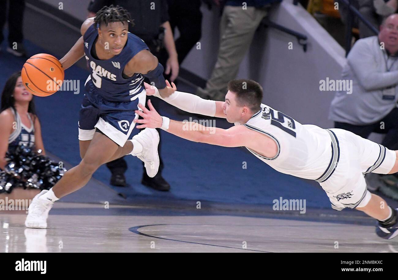 Utah State guard Rylan Jones (15) tries to foul UC Davis guard Ezra ...