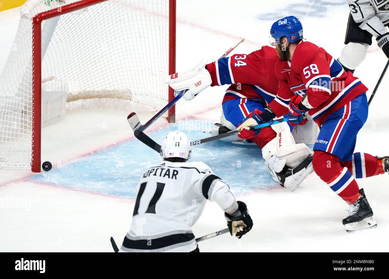 The puck hits the goal post behind Montreal Canadiens goaltender Jake ...