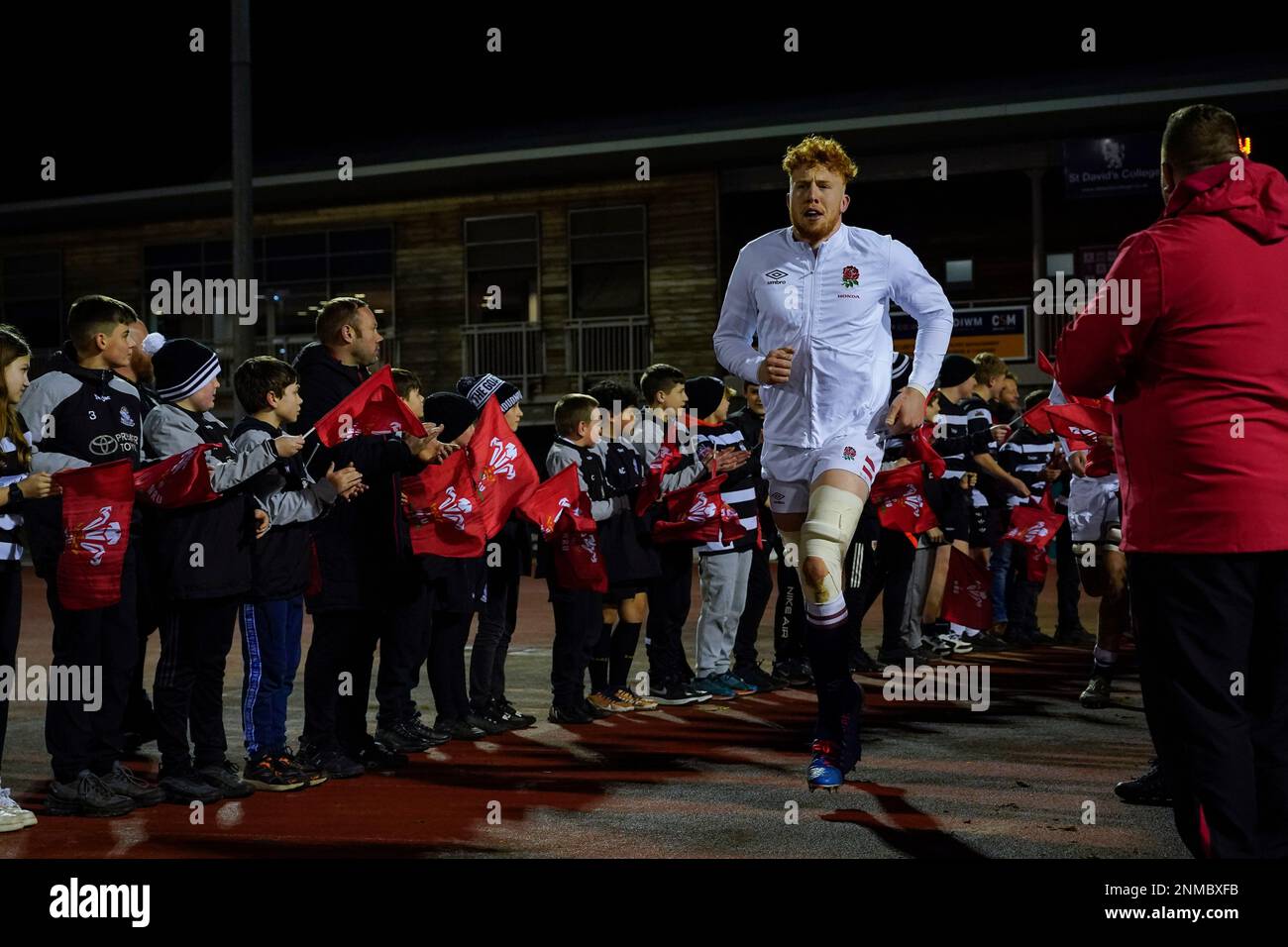 Lewis Chessum captain of England U20's leads out his team before the ...