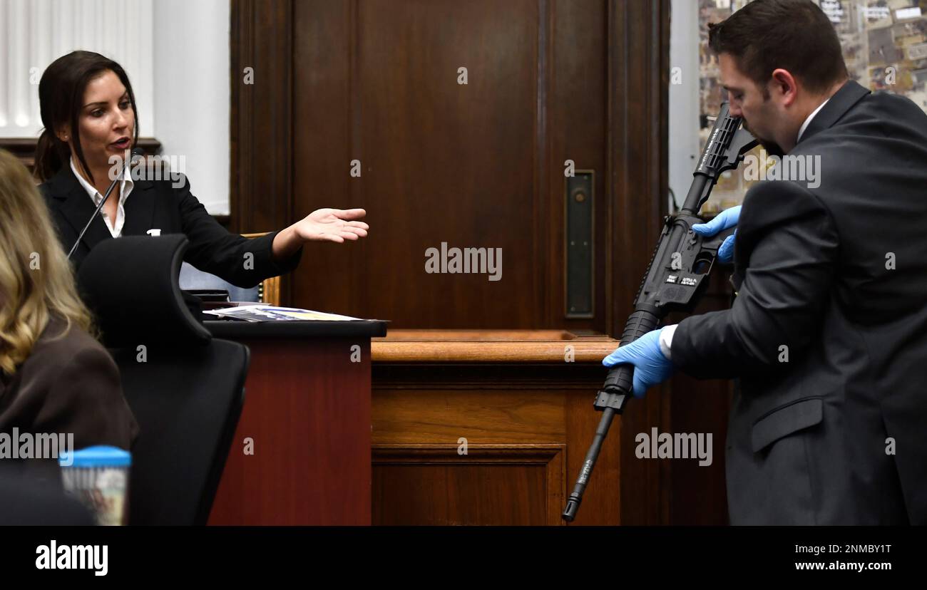 Heather Williams, a firearms and toolmark examiner, identifies the ...