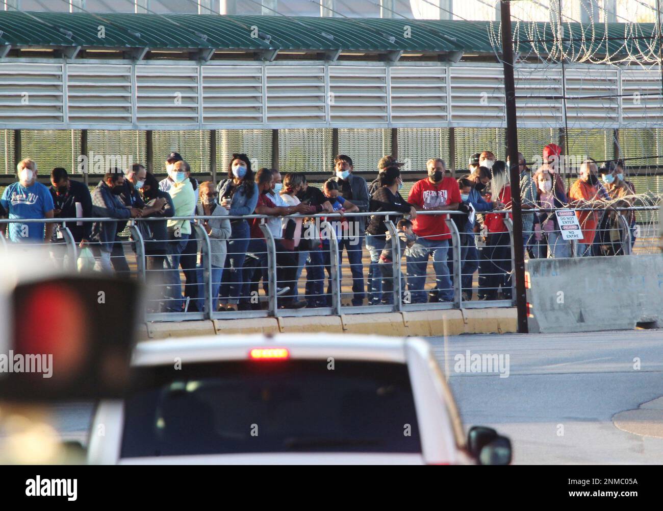 Pedestrians walk on the Hidalgo/McAllen International Bridge in Hidalgo ...