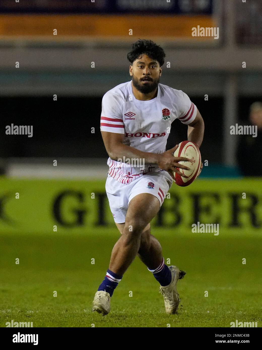 Rekeiti Ma'asi-White of England U20's runs with there ball during the ...