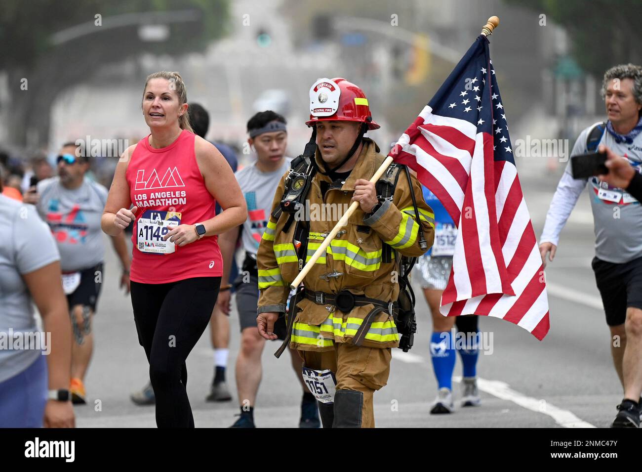 Federal firefighter Rudy Maron, of Ventura, runs wearing his turnout ...