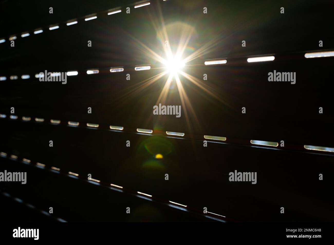Sunbeams in the window blinds Stock Photo - Alamy