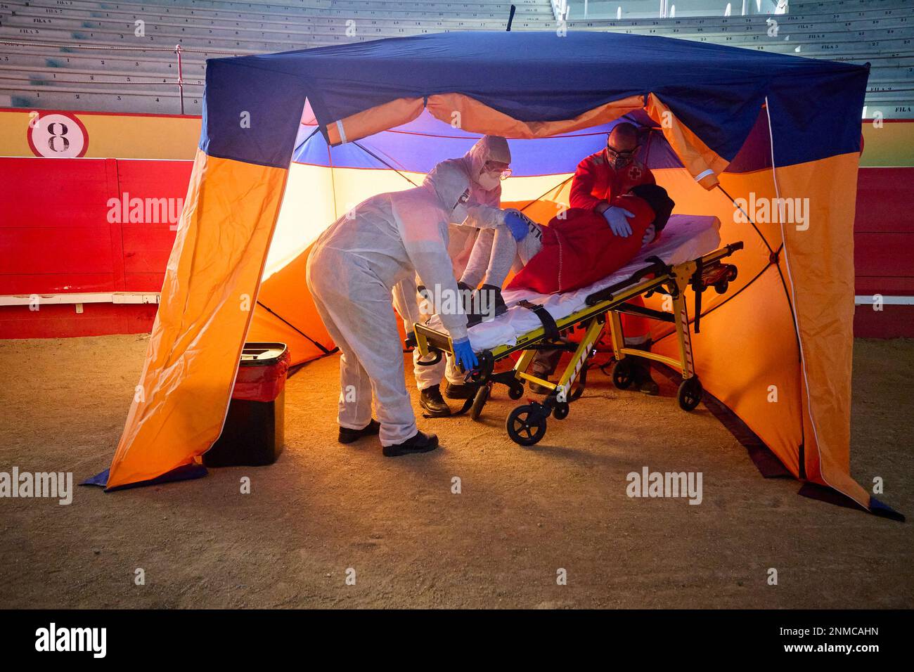 Red Cross personnel simulate care for the injured and their subsequent ...