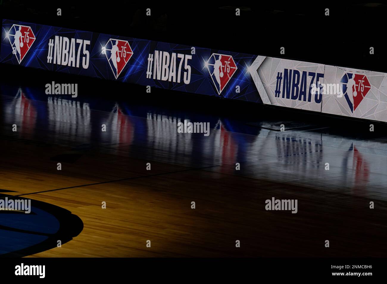 The NBA's 75th anniversary logo is seen alongside the court at halftime ...