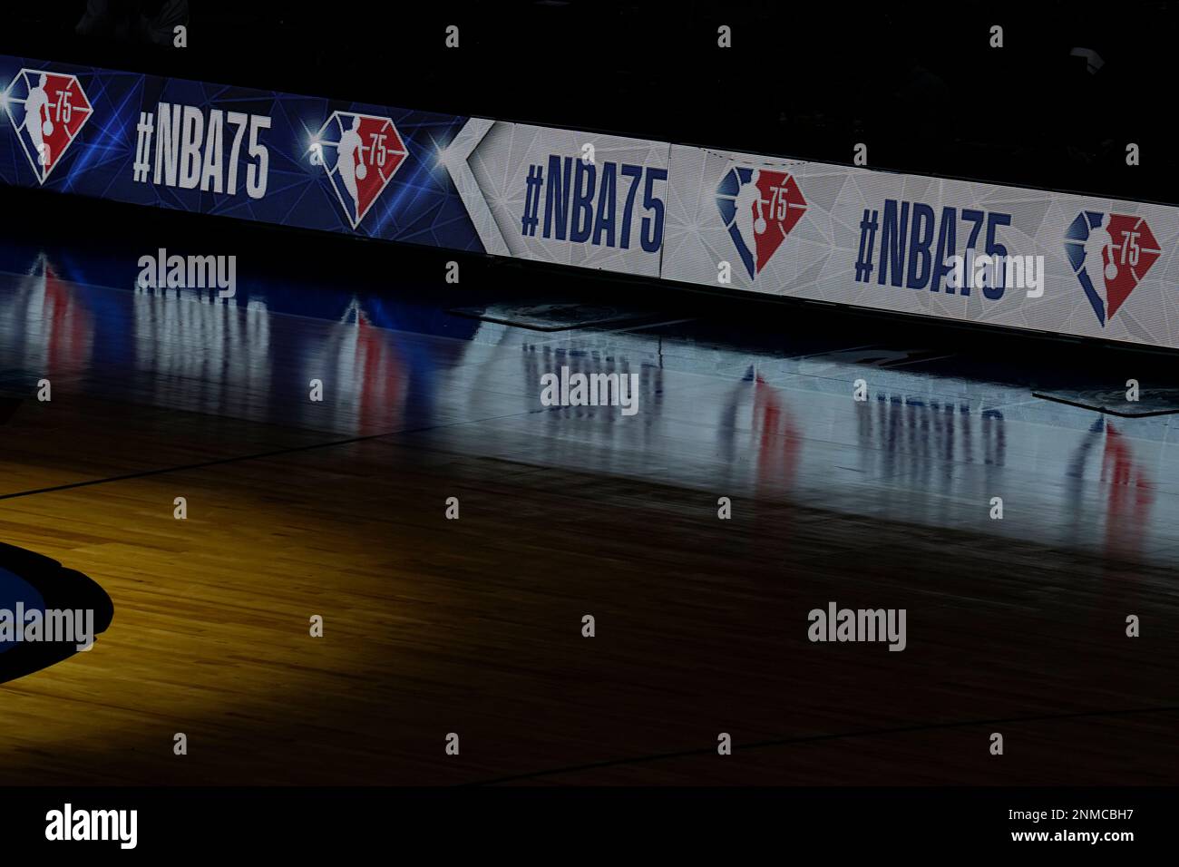 The NBA's 75th anniversary logo is seen alongside the court at halftime ...