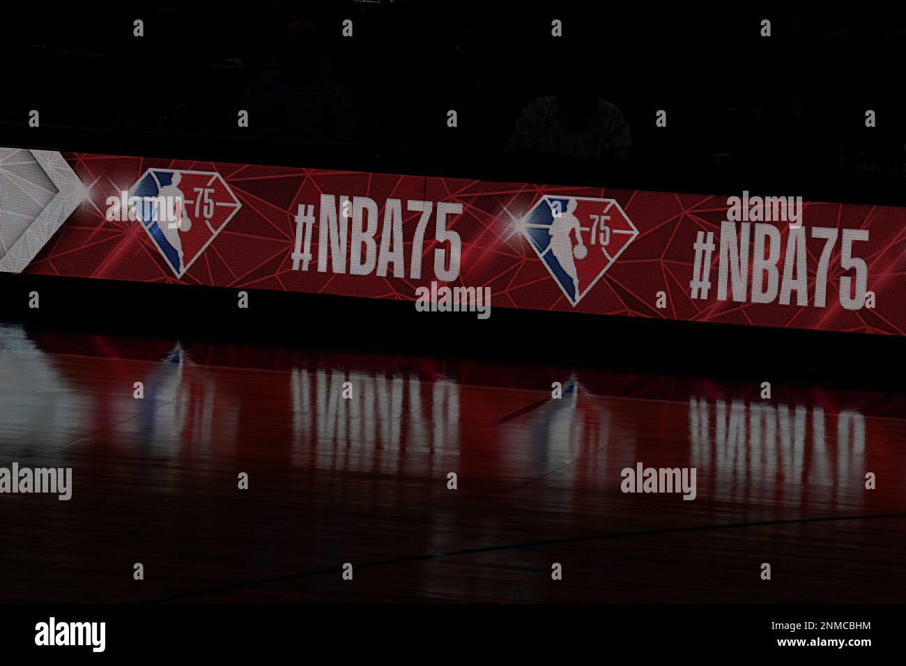 The NBA's 75th anniversary logo is seen alongside the court at halftime ...