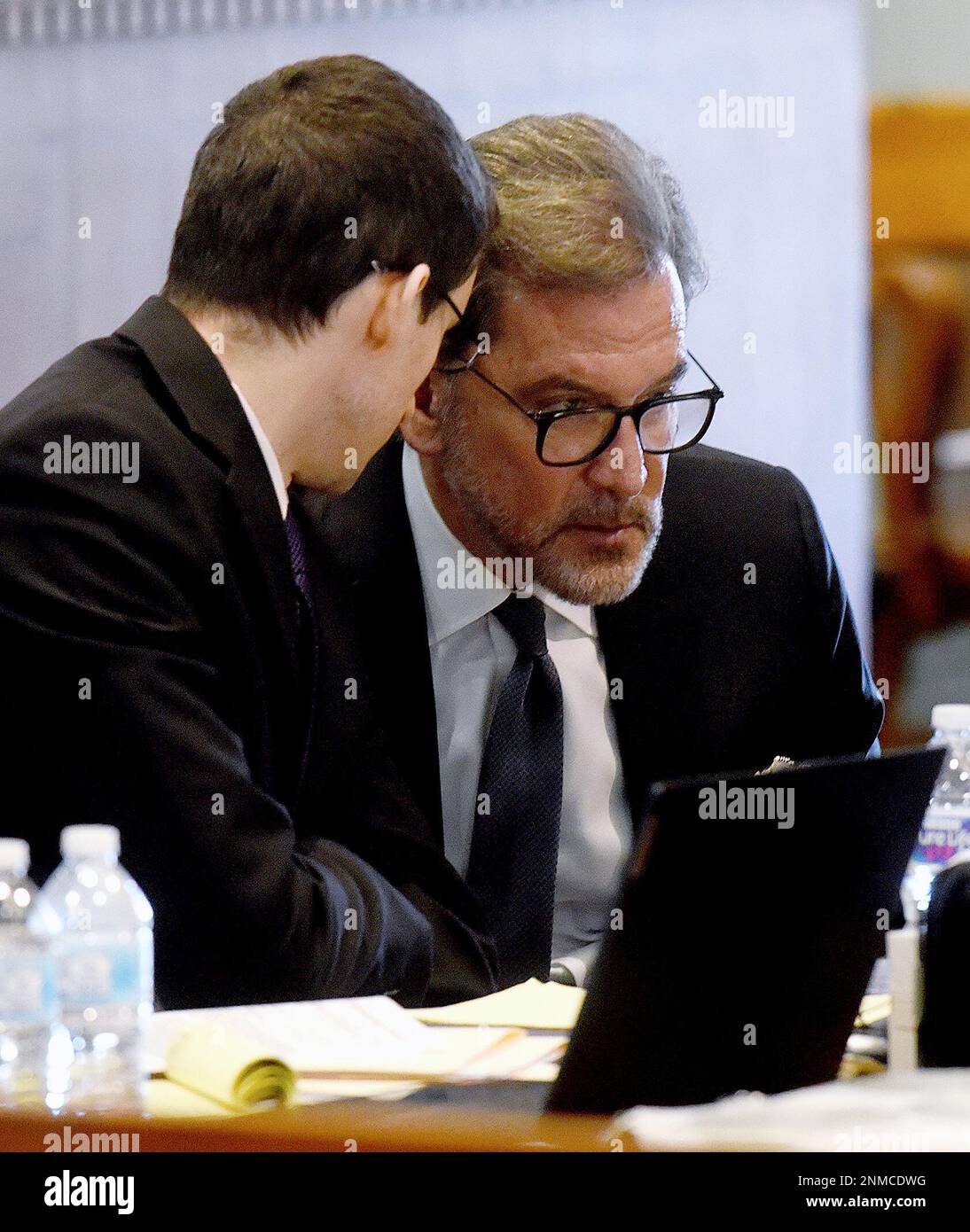 Joseph Elledge, left, confers with his attorney Scott Rosenblum during ...