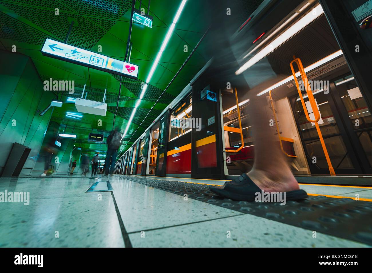 blurred figures on the subway station platform Stock Photo - Alamy