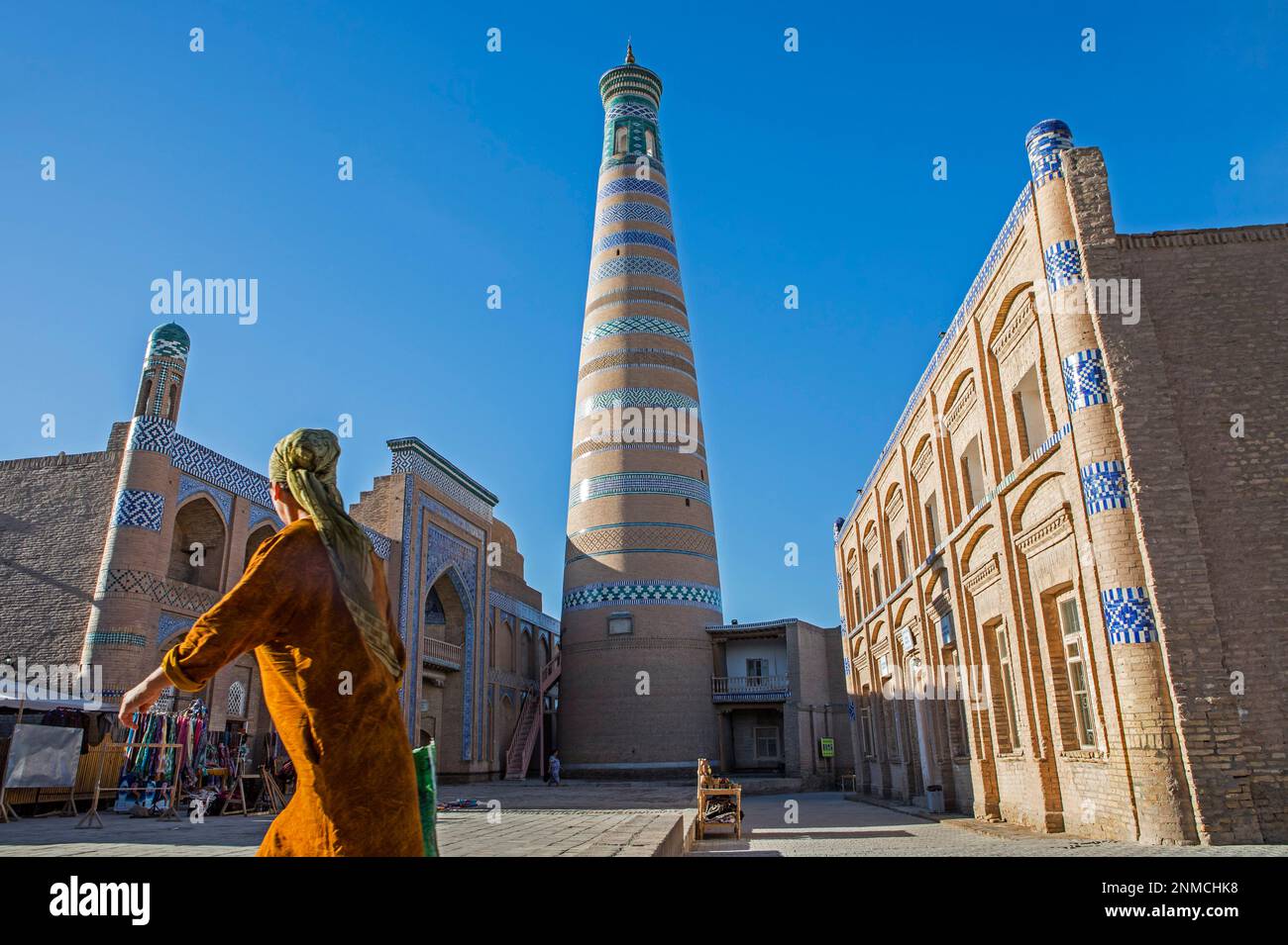 Islom Hoja Medressa and Minaret, street scene in Ichon-Qala, old city ...