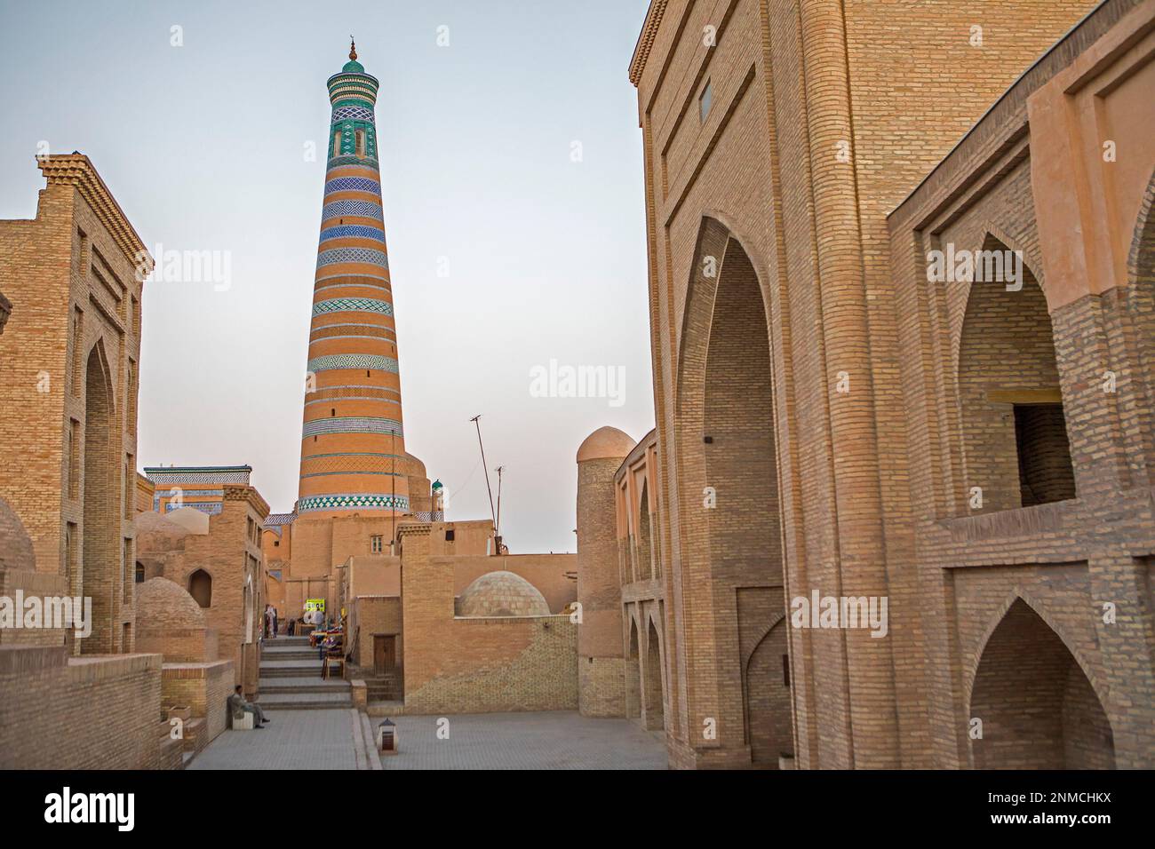 Islom Hoja Minaret. At right Sherghozi Khan Medressa, Khiva, Uzbekistan ...