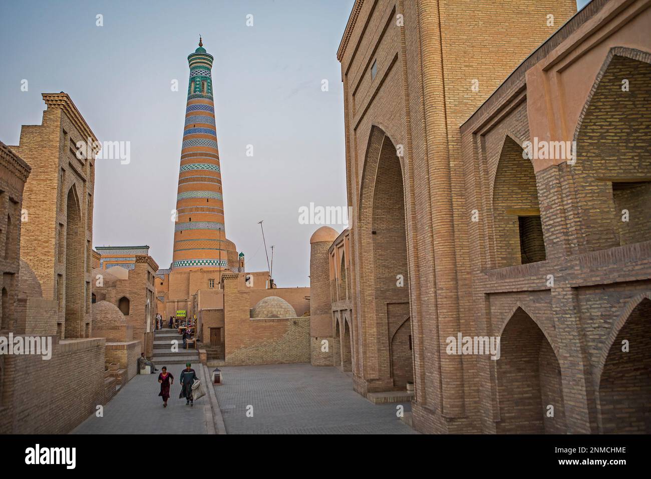 Islom Hoja Minaret. At right Sherghozi Khan Medressa, Khiva, Uzbekistan ...