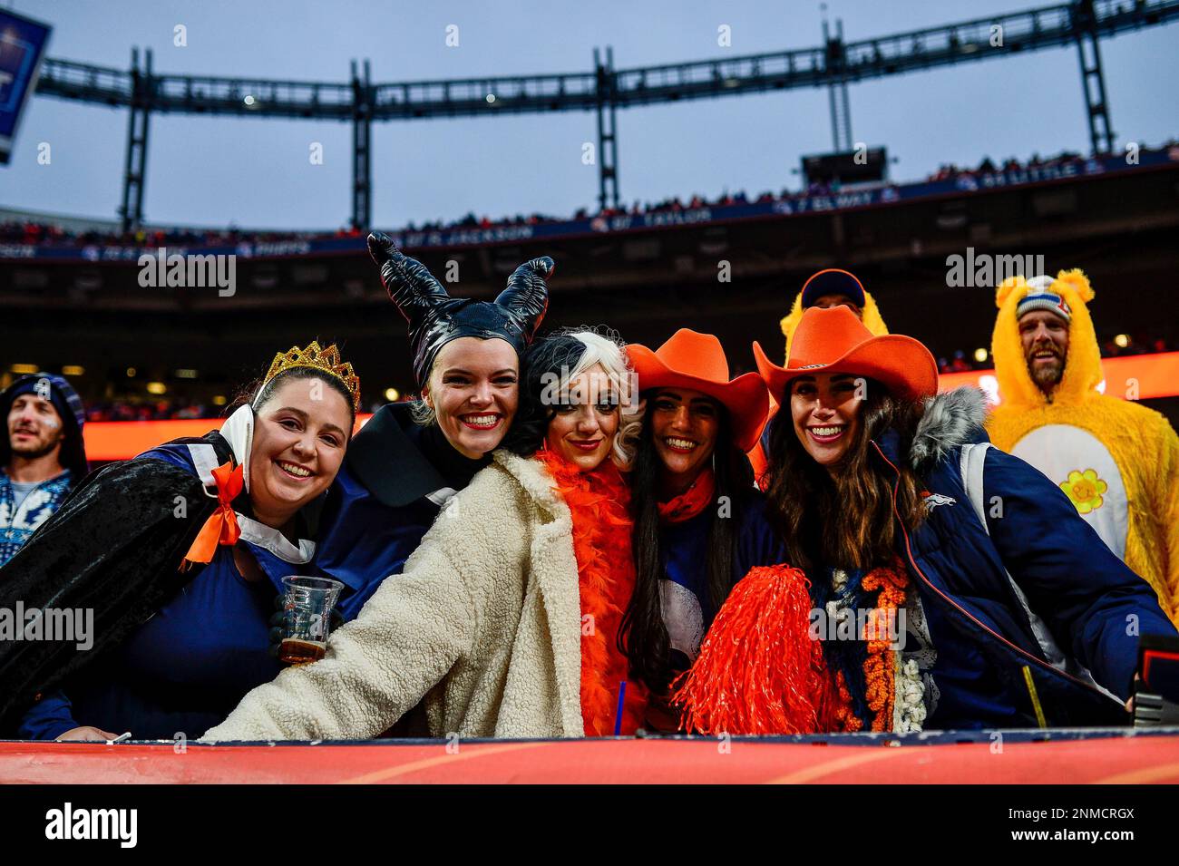 DENVER, CO - OCTOBER 31: Fans in Halloween costumes look on during a ...