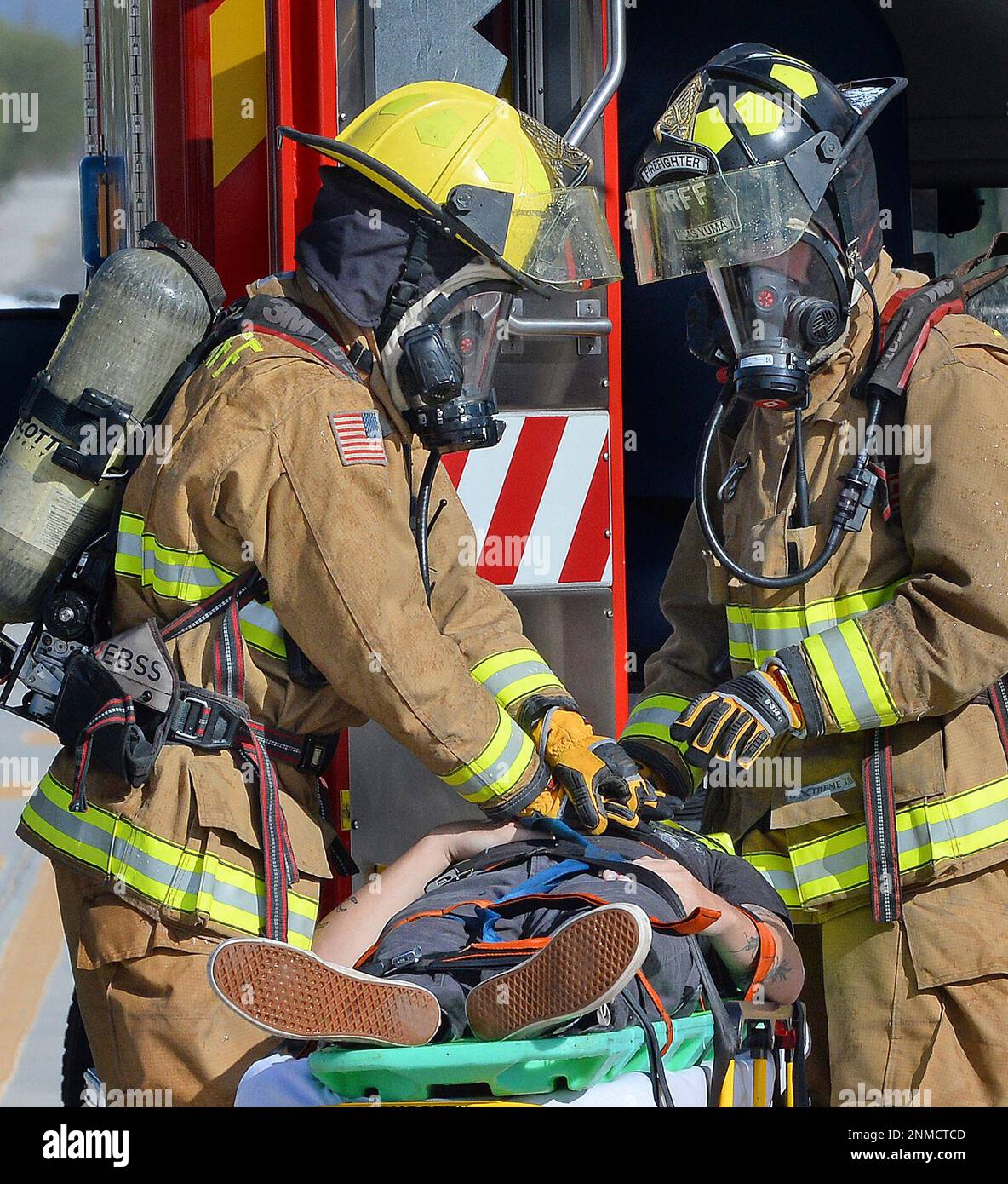 U.S. Marine Corps Air Station Yuma firefighters perform CPR on "Patient ...
