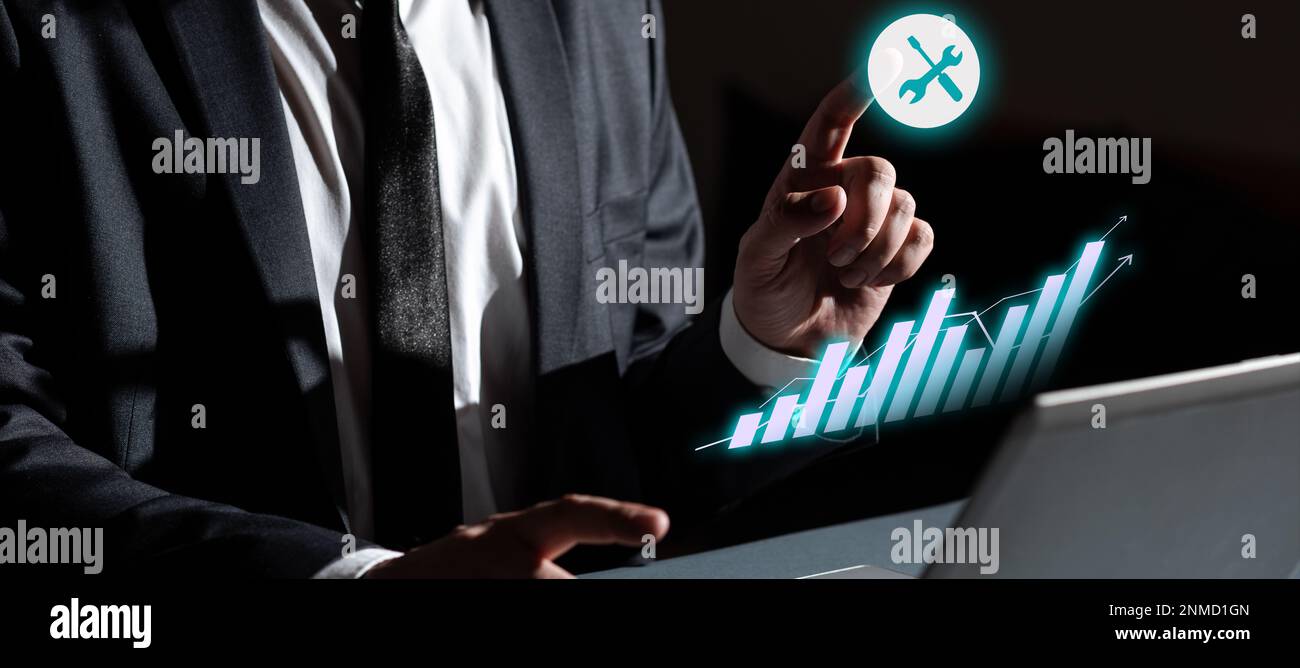 Businessman in office suit sitting at the table ant typing important ...