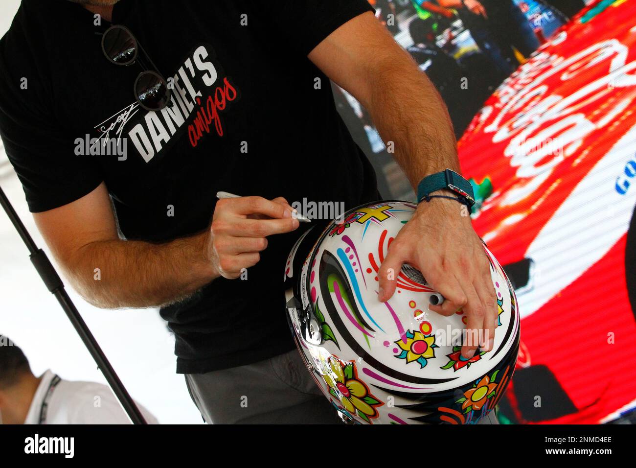 LAS VEGAS, NV - SEPTEMBER 26: NASCAR driver Daniel Suarez autographs a ...