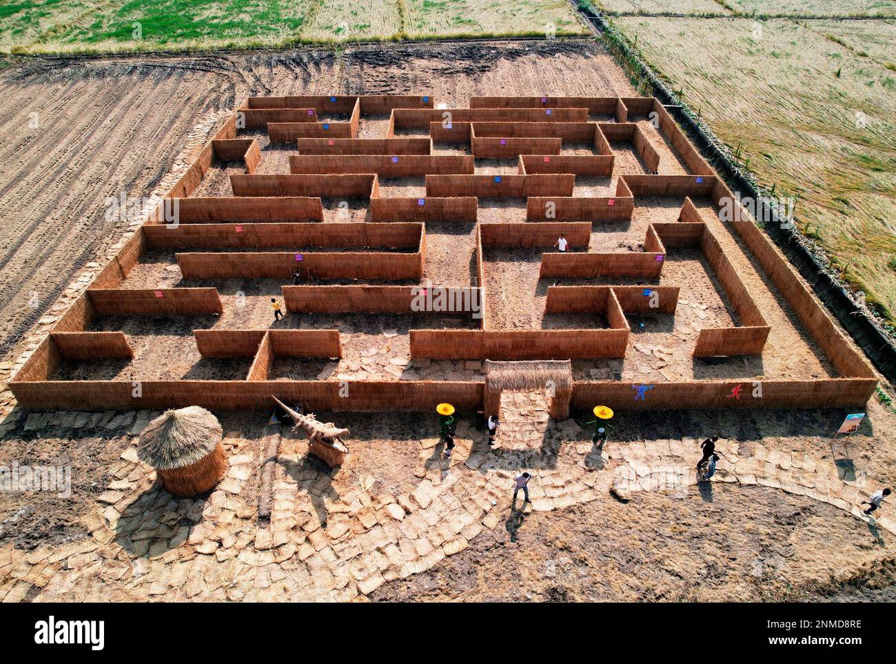 Tourists look for the exit of the 2,000-square-meter maze made of rice ...