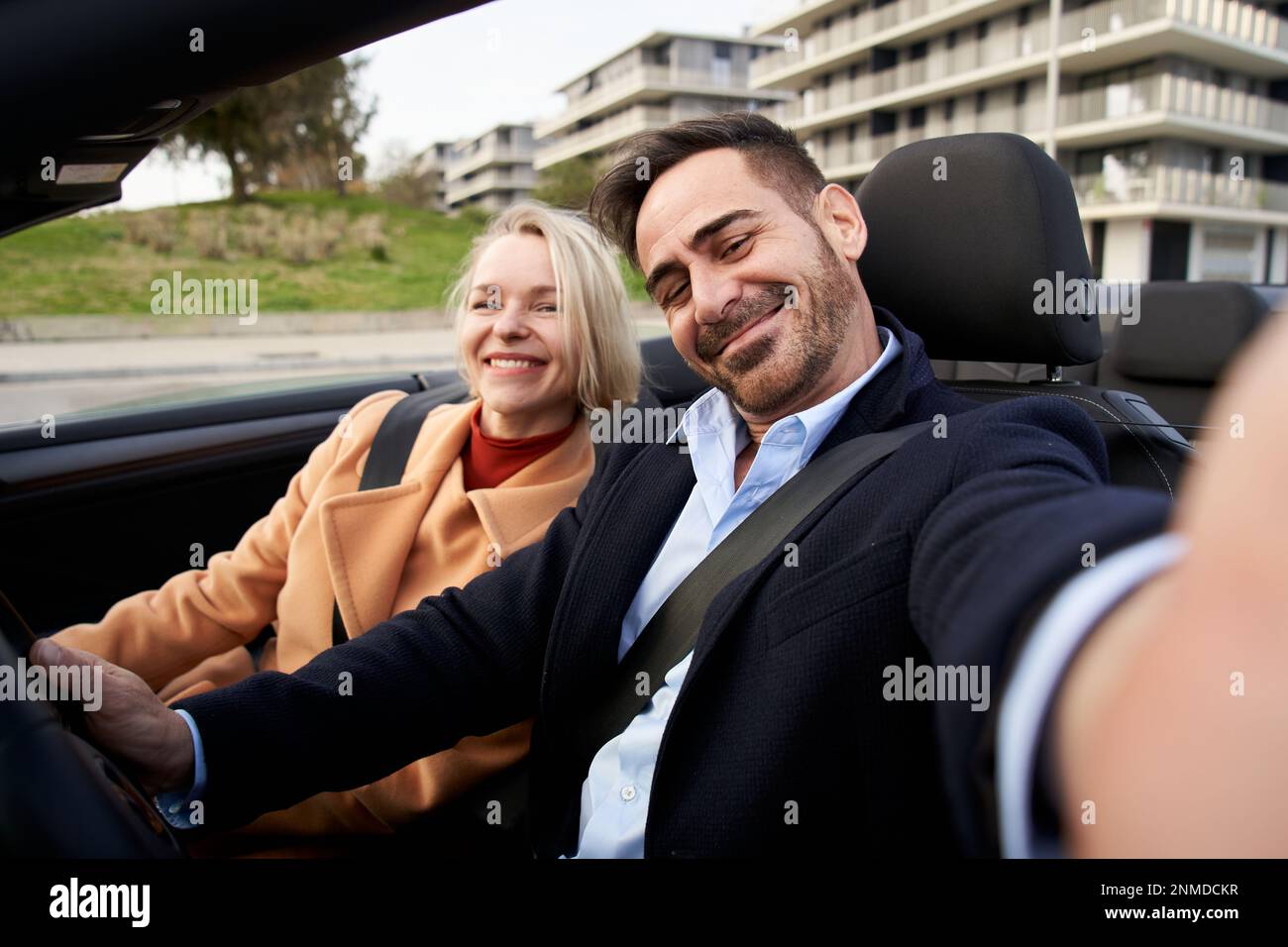 Happy Middle Aged Couple Takes Selfie In The Car Wife And Husband Pose