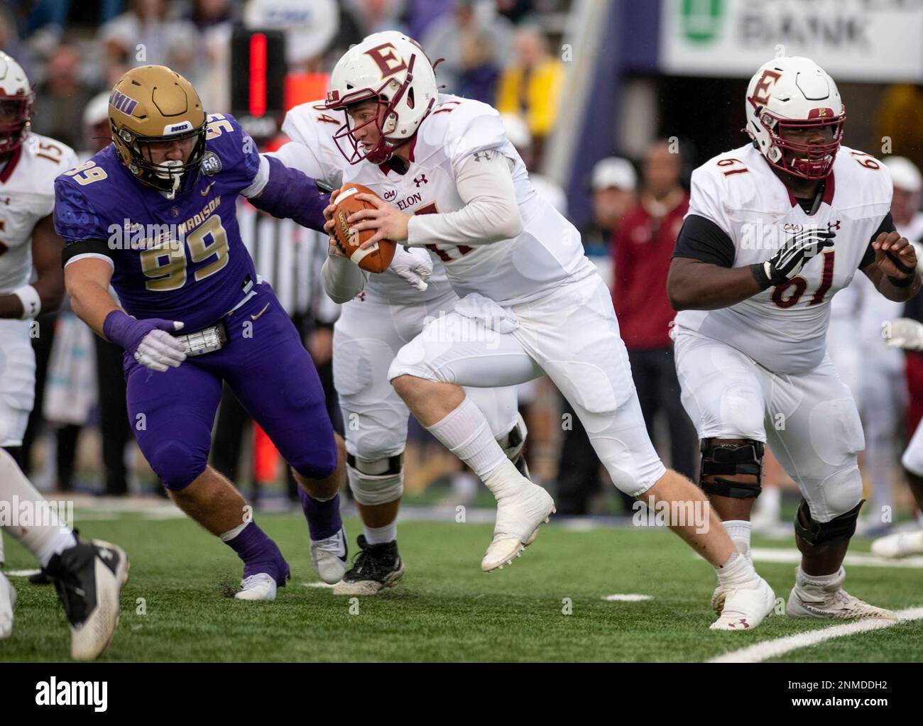 Elon quarterback Davis Cheek (17) finds a gap in the James Madison ...