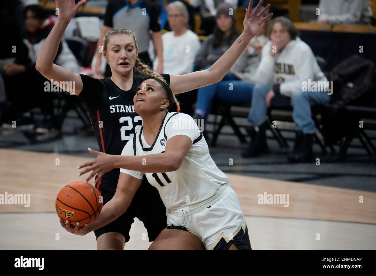 Colorado center Quay Miller (11) and Stanford forward Cameron Brink (22 ...