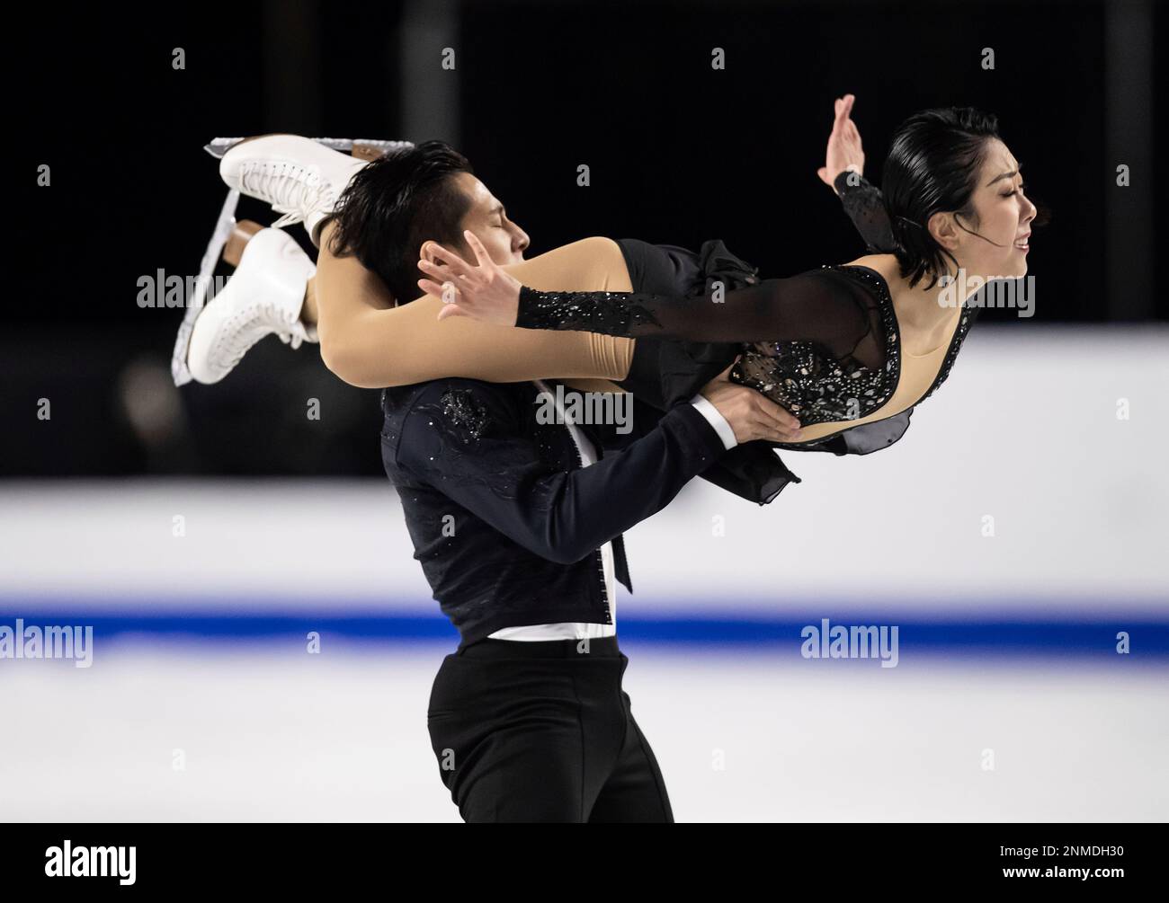 China's Sui Wenjing and Han Cong perform their pairs short program ...