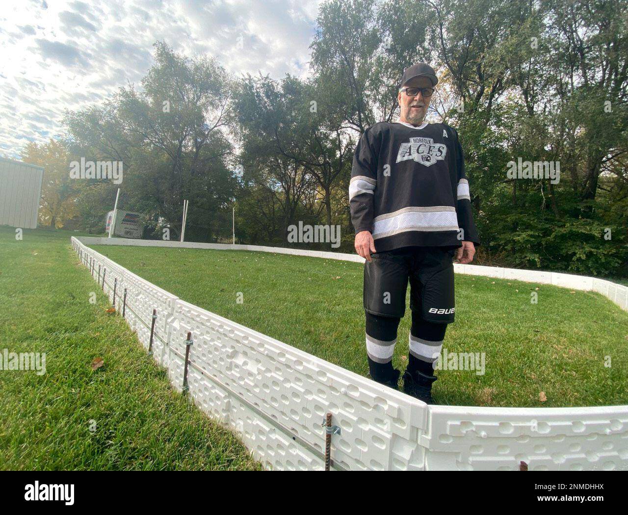 Steve Geary poses in the outdoor hockey rink he built at his home in ...