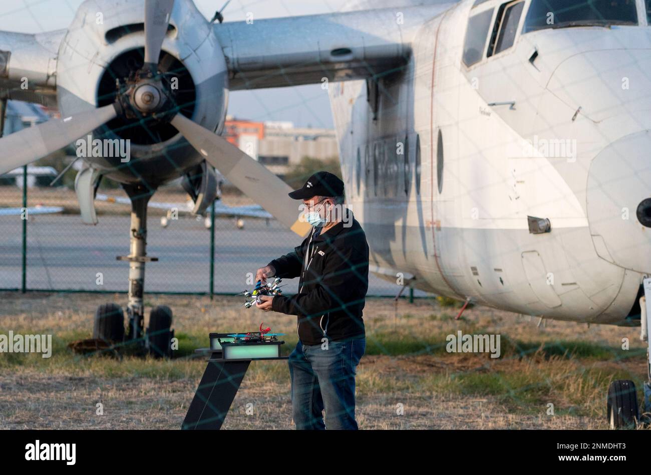 A man with a racing drone in the combined operation between drones and ...
