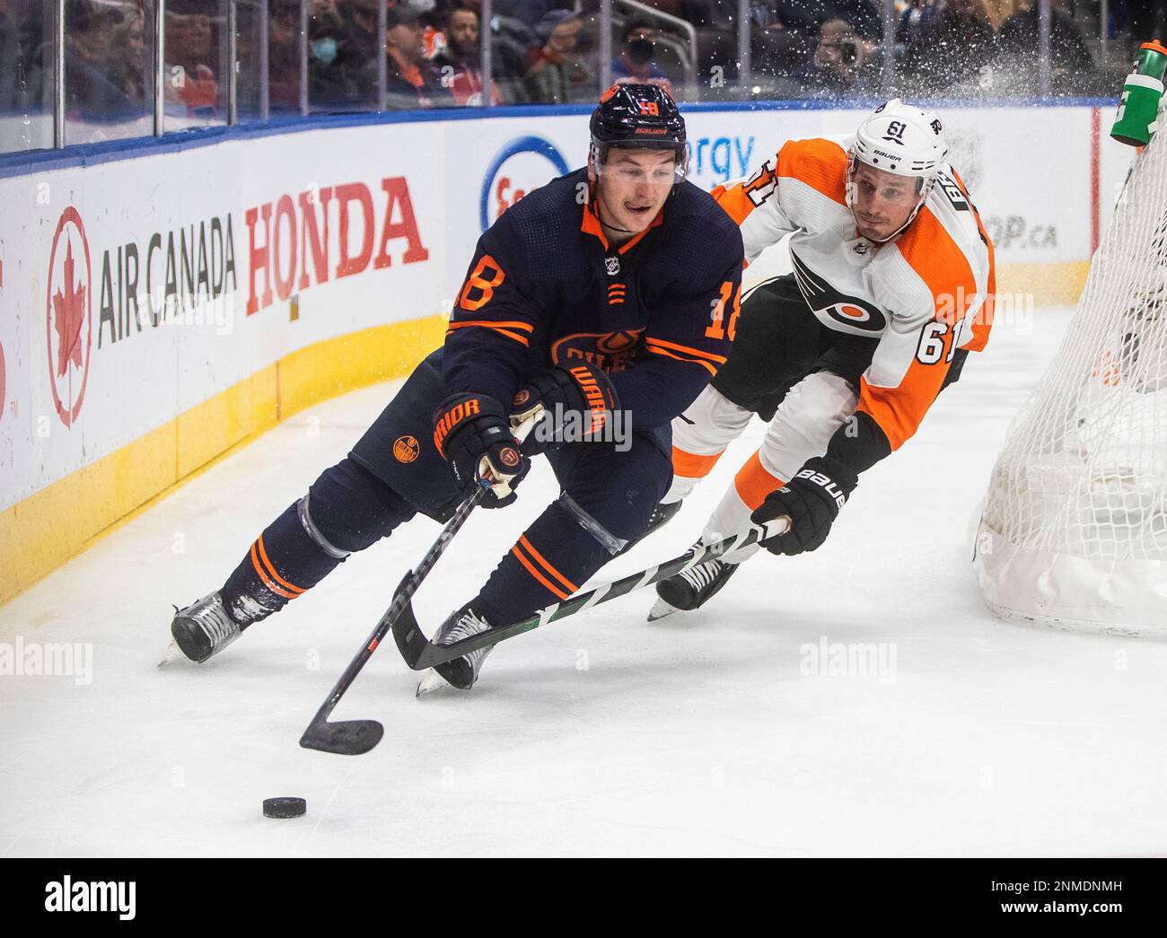 Philadelphia Flyers' Justin Braun (61) chases Edmonton Oilers' Zach ...